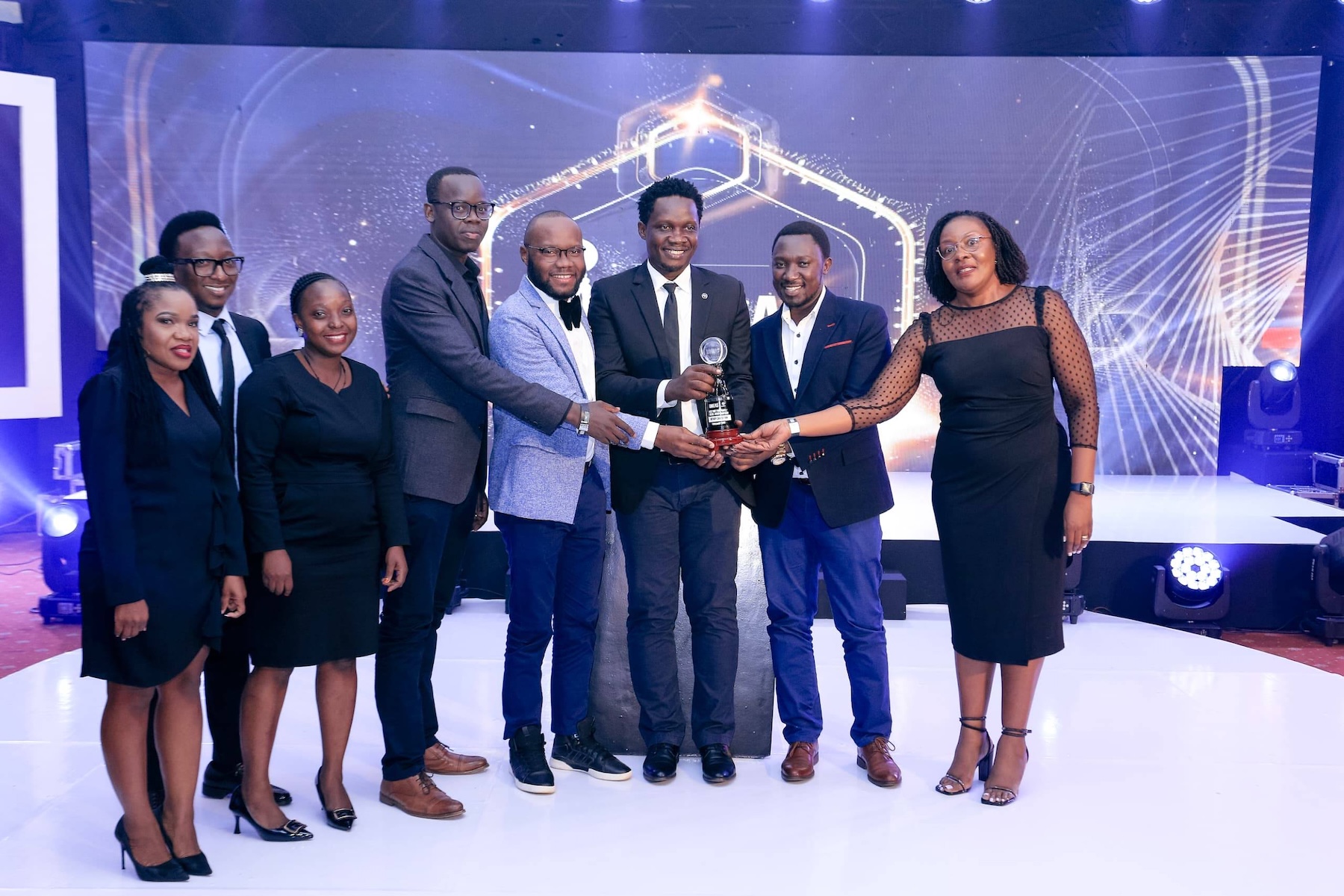 Team Centenary Bank being awarded by Kevin Masaba, General Manager ...